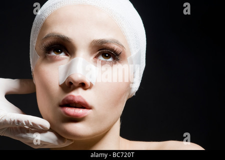 WOMAN FACE WITH ADHESIVE PLASTER BANDAGE OVER NOSE Stock Photo ...