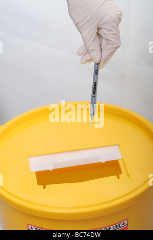 Sharps disposal container in hospital ward Britain UK Stock Photo - Alamy