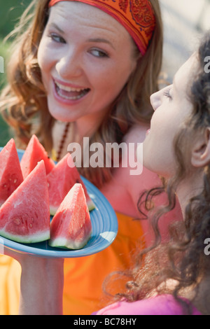 Woman holding wedge of watermelon FoodCollection Stock Photo - Alamy