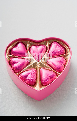 Pink chocolates in heart-shaped box Stock Photo - Alamy