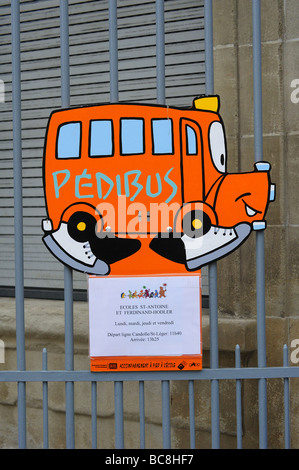 Walking School Bus Route sign painted on pavement Stock Photo - Alamy