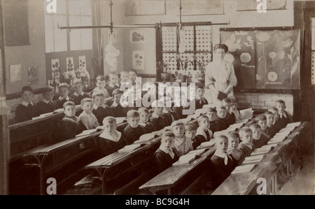 Edwardian infant children in a primary school classroom circa 1910 ...