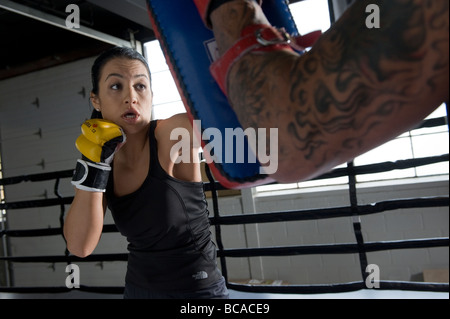 An action shot of a female boxer training Stock Photo - Alamy