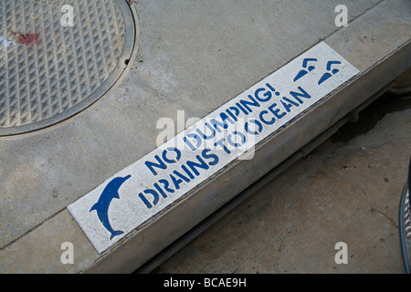 A warning sign, No dumping, drains to New York harbor, seen on Stock ...