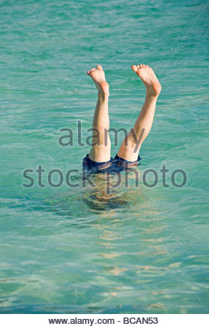 Boy doing a handstand in a swimming pool Stock Photo - Alamy