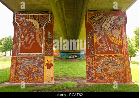 Outdoor art works painted on pylons of bridge spanning Lachlan River at ...