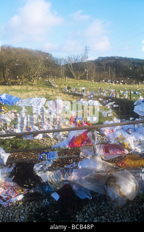 Plastic bags blown from a landfill site in Barrow in Furness, Cumbria ...