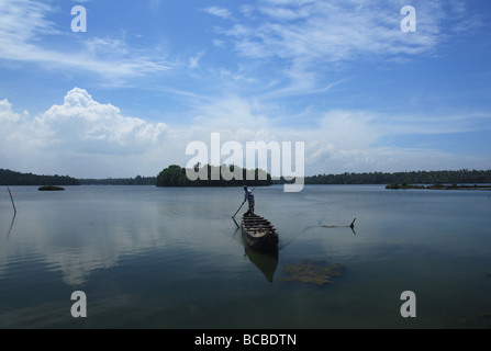 Wooden canoe taking visitors across lake to Ponnumthuruthu island ...
