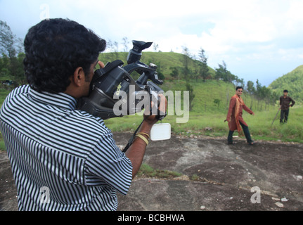 Cameraman filming an Indian couple in the hills of India Stock Photo ...