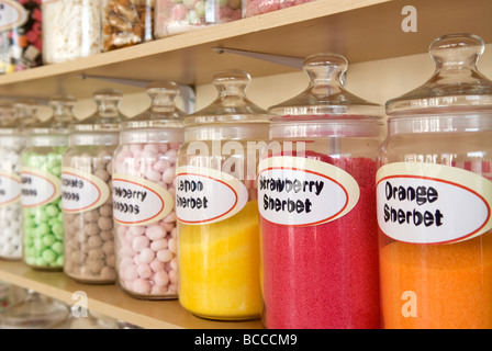 Jars of sweets on shelves at a traditional sweet shop in the Uk Stock ...
