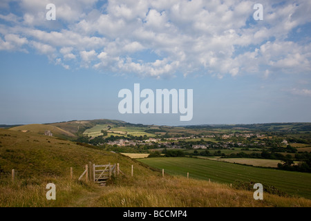 Corfe Castle as seen from the Purbeck Way footpath on the Purbeck Hills ...