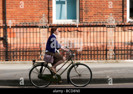 one caucasian cyclist woman cycling riding bicycle isolated on white ...