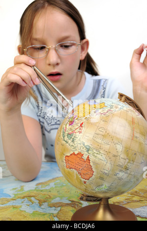Girl exploring the geographic map of Eurasia Stock Photo - Alamy