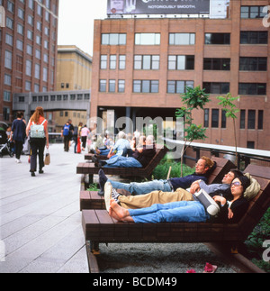 People relaxing outside on an Ipe wooden chaise lounge recliner ...