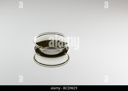 Oil splash caused by falling oil droplet Stock Photo - Alamy