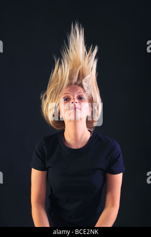 Blond woman throwing her head back Stock Photo - Alamy