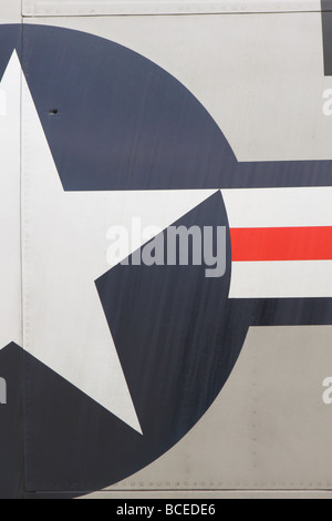US Navy military aircraft logo roundel over camouflage paint on side of ...