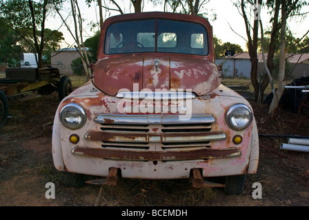 Rust eating away at the classic lines of an antique bus on a farm Stock ...