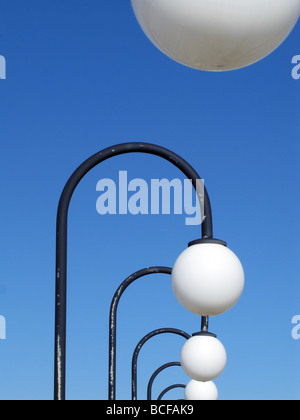 a long row line of street lights and blue sky Stock Photo - Alamy