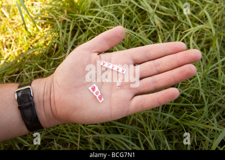 Various types of Acid LSD trips and microdots held in a mans hand Stock ...