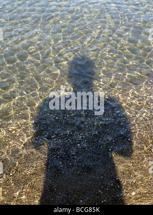 person's shadow in lake water surface Stock Photo - Alamy