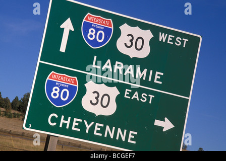 road signs for interstate 80 east and west with blue sky background ...