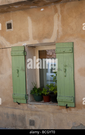 A wooden green shutters of a house, France Stock Photo - Alamy
