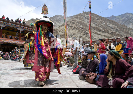 Buddhist monks watch a traditional dance performed by monks as part of ...