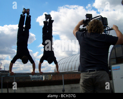 A TV camera and cameraman on a running track in a stadium in Komazawa ...