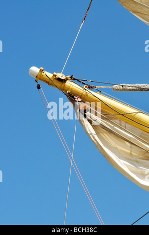 Sailboat yardarm with furled sail rigging and block and tackle Stock ...