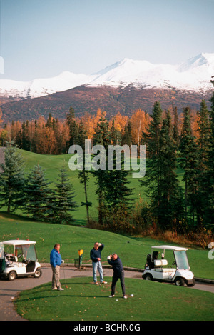 Group of male golfers on the tee, playing golf at 2am at night in The ...
