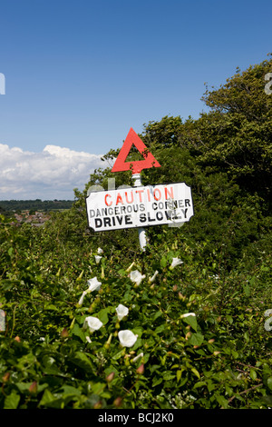 Dangerous corner warning sign Stock Photo - Alamy