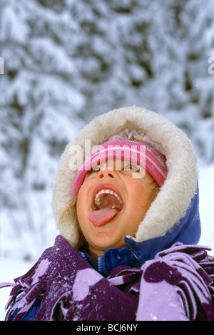 Young Girl Catching Snowflakes on Tongue SC AK Winter Stock Photo ...