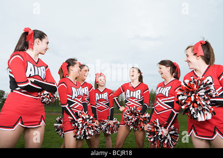 Teenage cheerleader (16-17) group and teenage sportsman (16-17 Stock ...