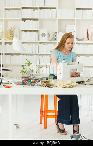 Fashion designer sewing Stock Photo - Alamy