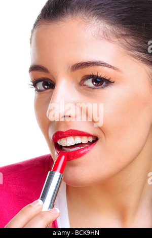 attractive girl in red shiny dress hiding joker card in dress isolated ...