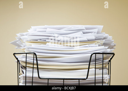 Overflowing paper inbox Stock Photo - Alamy