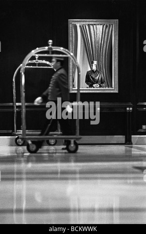 bellhop pushing luggage cart Stock Photo - Alamy