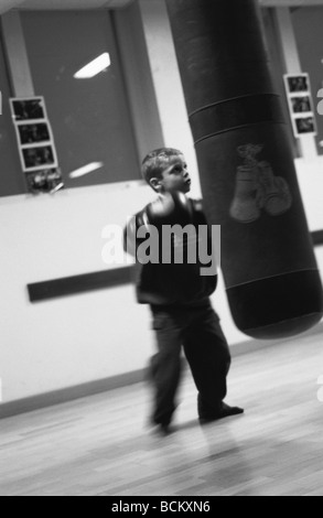 Boy Boxing Training Punching Bag Exercise Concept Stock Photo - Alamy