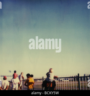 Group of people next to a fence on the north side; Strike Stock Photo ...