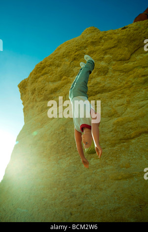 Doll falling off cliff Stock Photo - Alamy