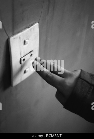 The child touches the electrical outlet with his hand. Electric shock ...