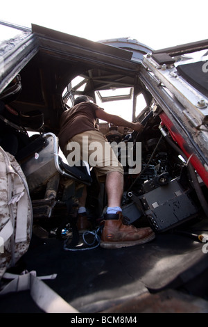 Storm chaser Sean Casey loads an IMAX camera into his Tornado Intercept ...