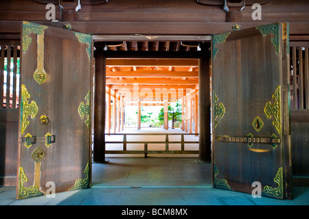 Doors at Shinto shrine in Tokyo, Japan. Name plate of the shrine above ...