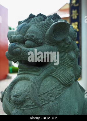 An Imperial Guardian Lion, a mythic protector, stands guard at a temple ...