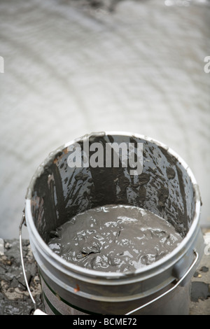 A bucket of mud dug up from the bubbling mud pools of Rincon de Viejo ...