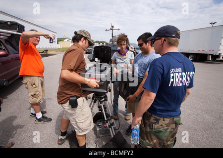 Sean Casey s IMAX team loads film into an IMAX camera during Project ...