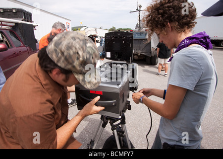 Sean Casey s IMAX team loads film into an IMAX camera during Project ...