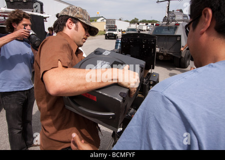Sean Casey s IMAX team loads film into an IMAX camera during Project ...