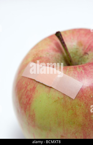 apple with plaster Stock Photo - Alamy